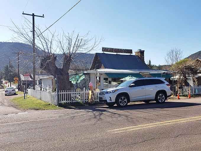 White picket fences and mountain backdrops make this tiny town look like it escaped from a Norman Rockwell painting.