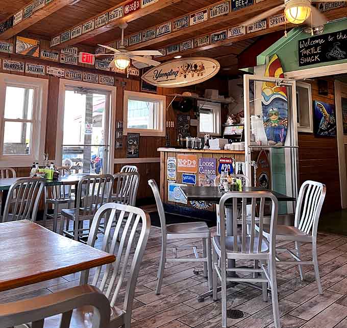 License plates and surfboards create a beachy time capsule where every meal feels like a mini-vacation.