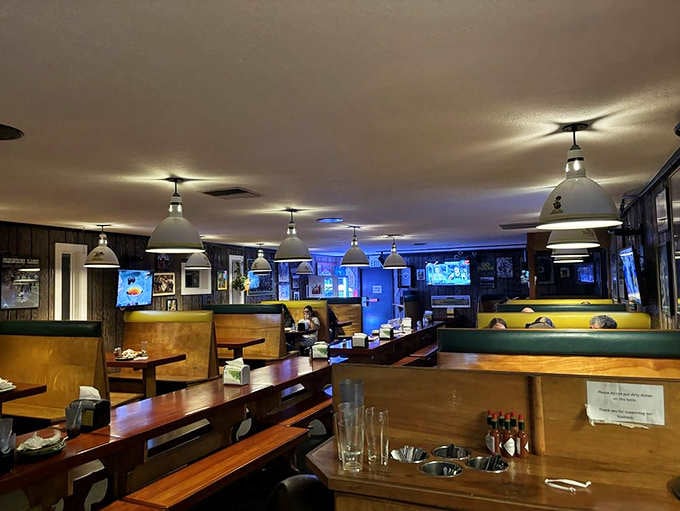 Warm pendant lighting and cozy booths create the perfect atmosphere for lingering over slices with friends and family.