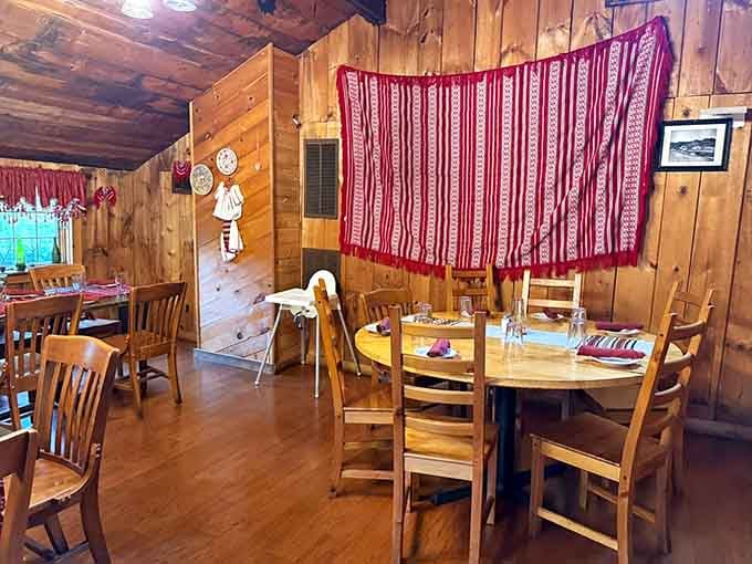 Wood-paneled walls and traditional textiles create a cozy Romanian retreat that feels worlds away from Route 1.