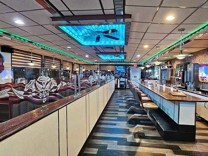 Checkered floors and neon lighting create that timeless diner atmosphere where every meal feels like a celebration.