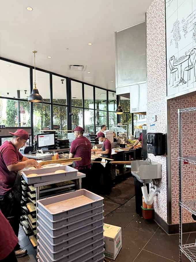 Watch the magic happen through floor-to-ceiling windows as skilled hands transform dough into edible art right before your eyes.