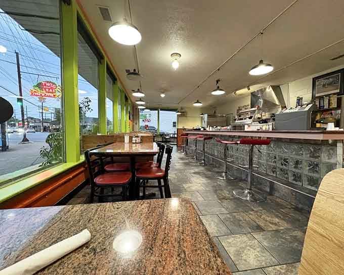 Classic counter seating with chrome stools and booth options means everyone gets their preferred spot for serious eating.