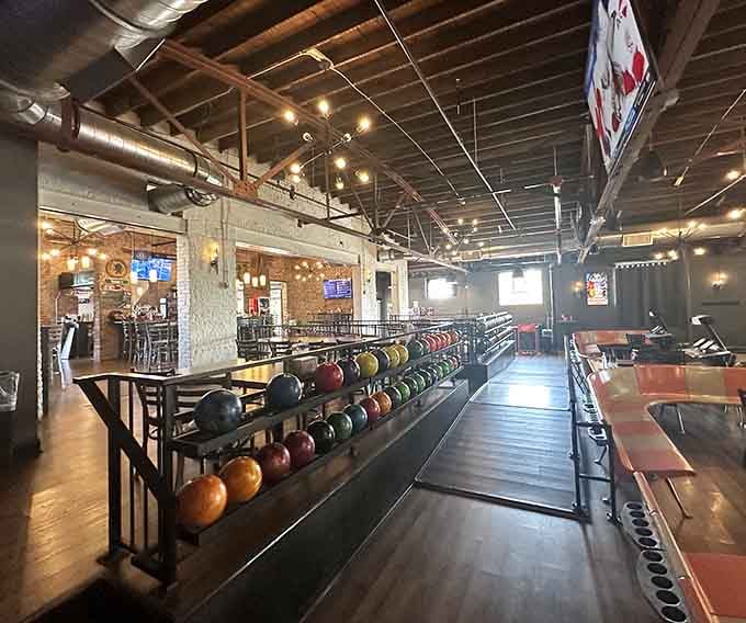 Colorful bowling balls lined up like candy in the world's most satisfying vending machine you'll ever see.