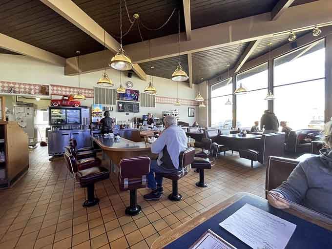 Classic counter seating where locals have been solving the world's problems over coffee for generations, one refill at a time.