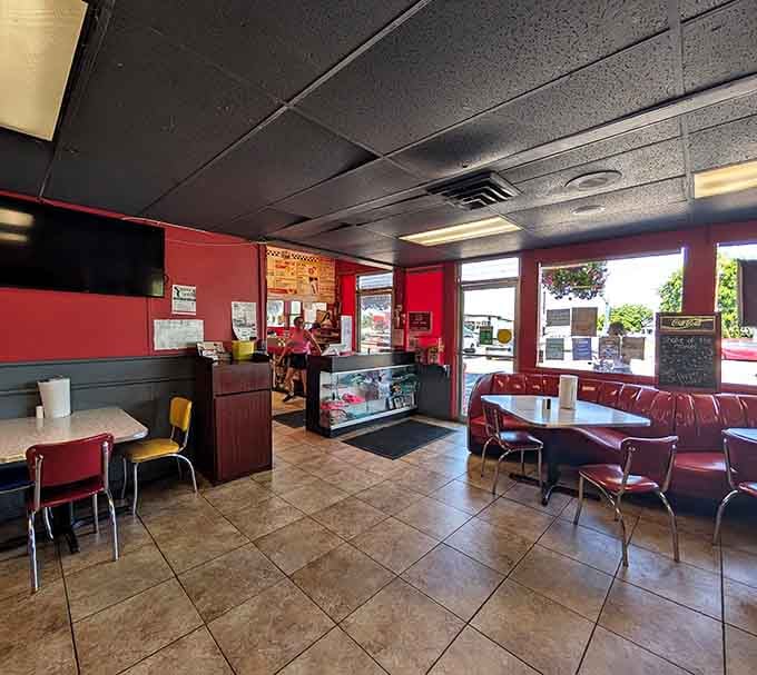 Red vinyl booths and checkered floors: where comfort food meets comfortable seating in perfect harmony.