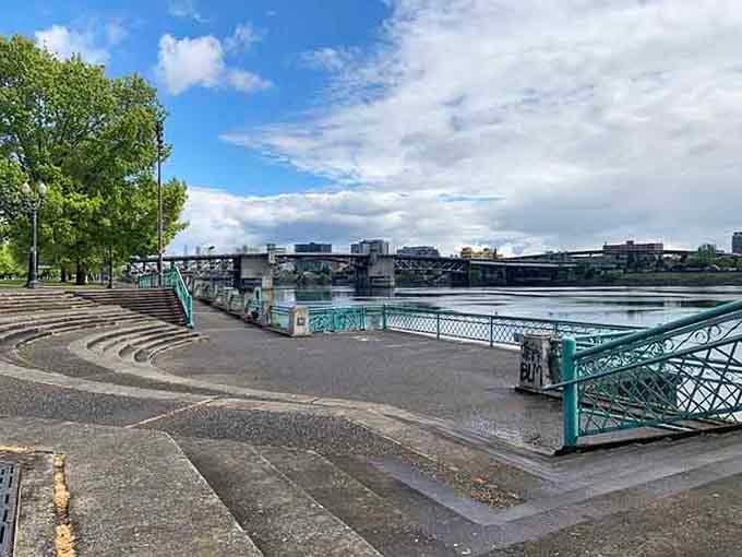 The amphitheater's curved steps offer front-row seats to the river's daily performance, no ticket required.