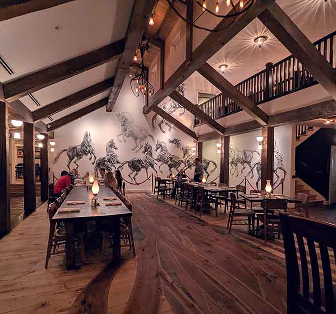 Those soaring beams and dramatic horse art aren't just decoration, they're a full-blown Western experience come to life.