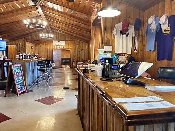 Wood paneling and vaulted ceilings create the kind of welcoming space where strangers become friends over pulled pork.