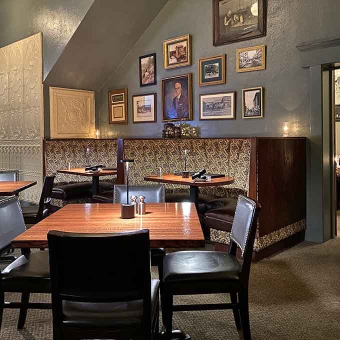 Cozy booths, vintage photographs, and tin ceilings create the perfect backdrop for serious steak conversations.