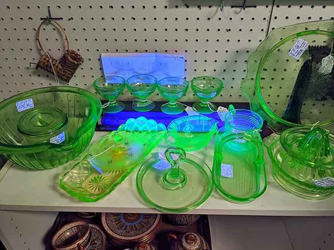 Depression glass glowing like kryptonite under the lights, each piece a survivor of harder times.