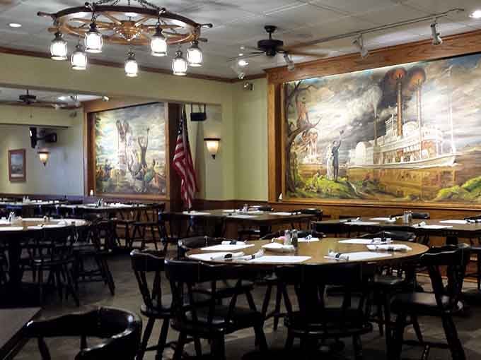 The dining room feels like a comfortable gathering place where murals tell stories and tables welcome families ready to feast.