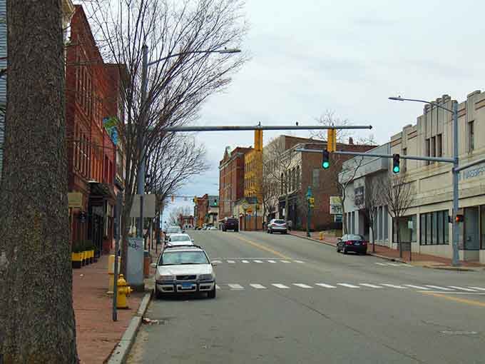 Main Street's brick-lined charm whispers stories of mill town glory days while inviting you to write new ones.