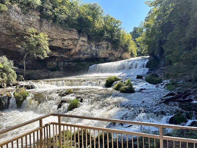 Willow Falls cascading through ancient rock layers like a geological masterpiece that took millennia to perfect.