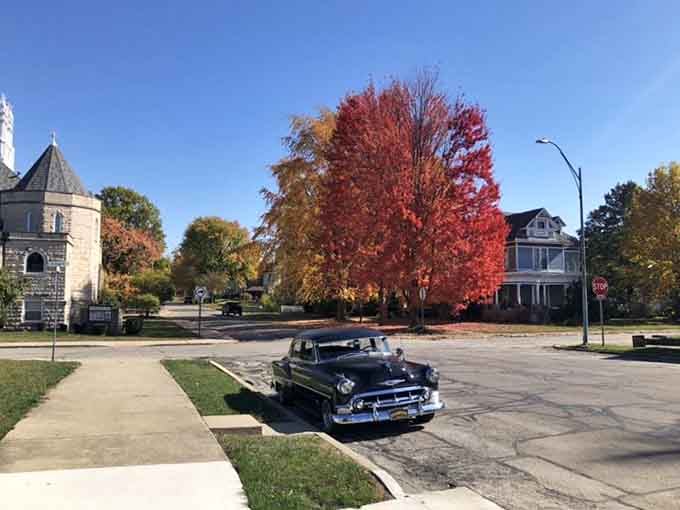 Fall colors explode across Winchester streets where classic cars still feel right at home cruising past historic architecture.