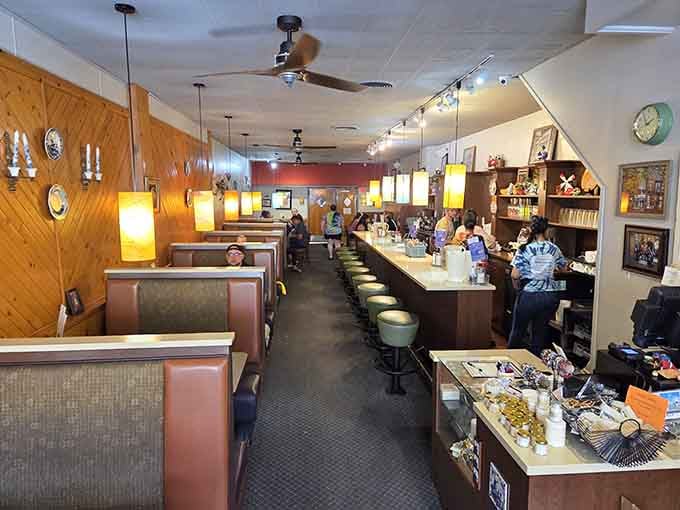 Classic diner booths and counter seating create the perfect stage for serious breakfast conversations and coffee refills.