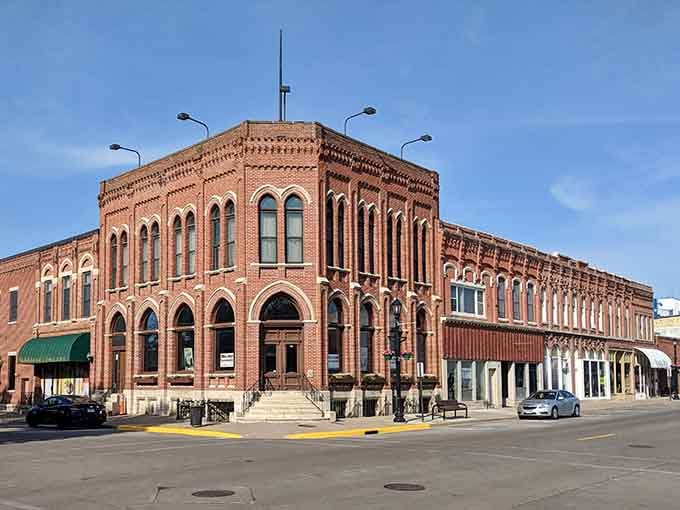 This commanding corner building anchors downtown with the kind of architectural confidence that modern glass boxes can only dream about achieving.
