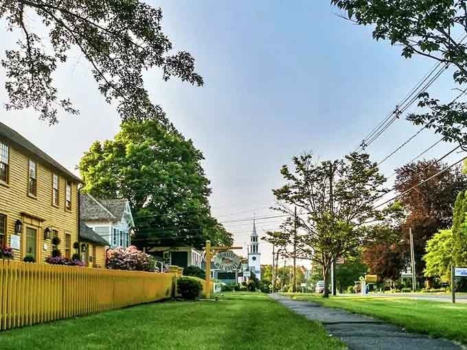 Church steeples peeking through the trees down this quiet lane, pure Connecticut charm without even trying.
