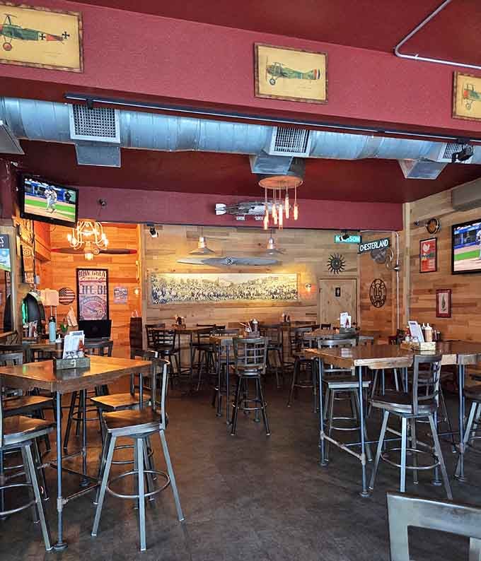 Inside, vintage airplane prints and wood paneling create a relaxed vibe where serious barbecue happens without the pretension.