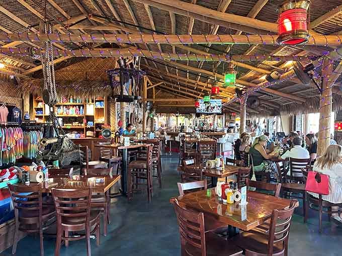 Under that thatched roof, colorful lights and nautical charm create the kind of atmosphere where stress goes to retire permanently.