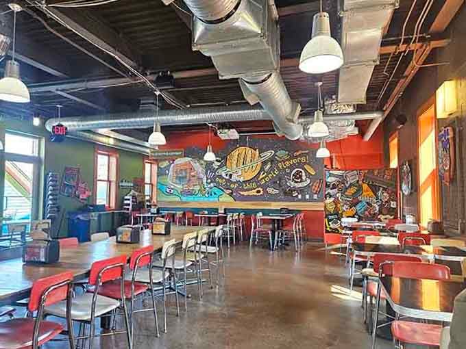 Industrial chic meets cozy comfort in this spacious dining area where communal tables encourage friendly food conversations.