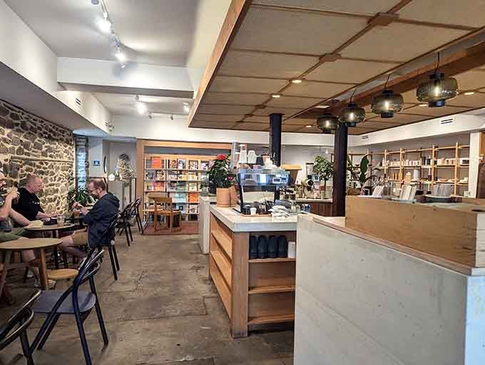 Exposed stone walls meet modern minimalism in a space that feels like your coolest friend's living room, if they had impeccable taste.