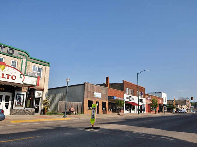 A quiet Main Street moment where small-town storefronts and wide-open skies remind us that America's heartland still beats strong.