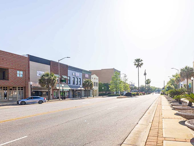 Palm trees lining empty streets create a peaceful scene that feels like Sunday morning year-round.