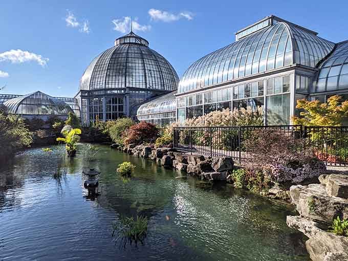 Glass domes rise like crystal palaces where tropical dreams flourish year-round, regardless of winter's icy grip outside.
