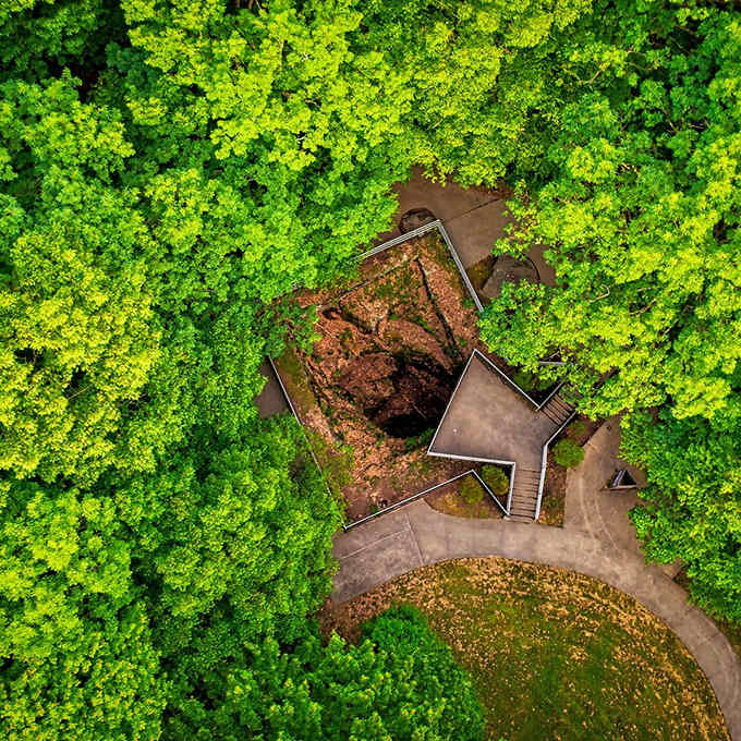 From above, the world's largest glacial pothole looks like Earth's belly button surrounded by a forest blanket.