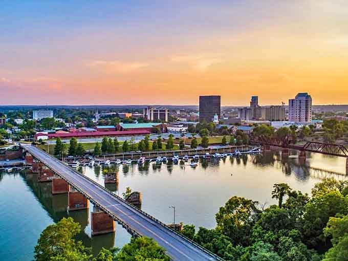 Augusta's bridge spans the Savannah River at sunset, connecting two states with one breathtaking view worth the drive.