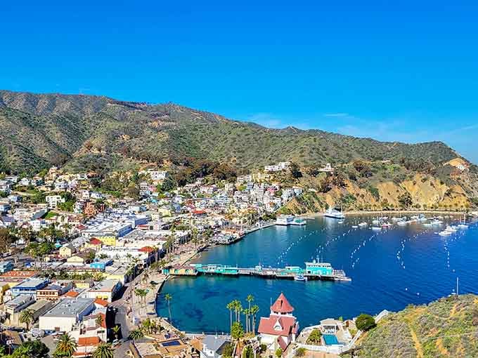 This jewel-toned harbor sparkles like a postcard, where colorful houses cascade down hillsides to meet crystal-clear waters.