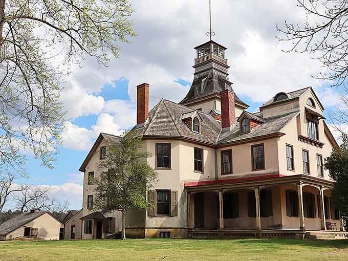 That tower rising above the mansion looks like something from a Victorian mystery novel come to life.