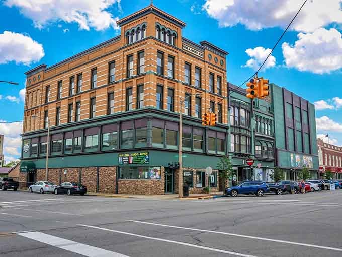 Historic brick buildings stand proud under blue skies, their ornate details reminding you when craftsmanship actually meant something special.