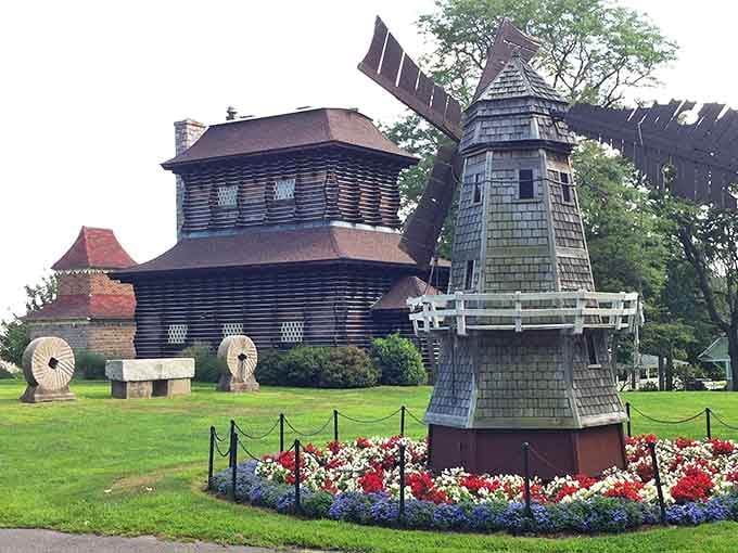 A windmill standing guard over historic buildings creates a scene straight from a Dutch countryside painting, right here at home.