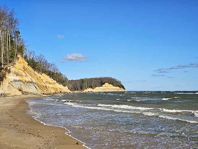 Those golden cliffs rising from the beach look like nature's own layer cake, millions of years in the making.
