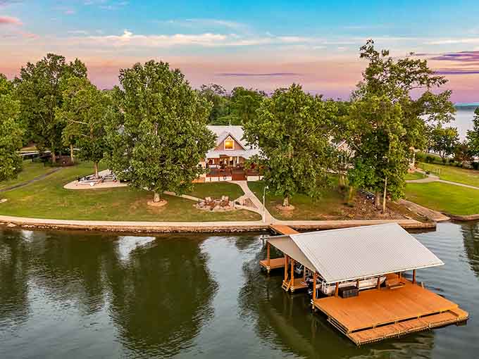 Sunset paints the sky over this lakeside paradise where your dock awaits and fishing poles never rest long.