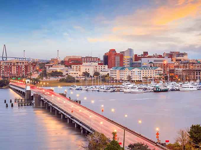 Golden hour paints the harbor in warm hues while that iconic bridge connects past and present across shimmering water.