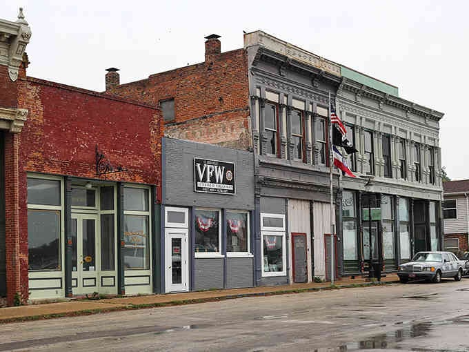 Weathered storefronts along this quiet street tell stories of river commerce from a bygone era.