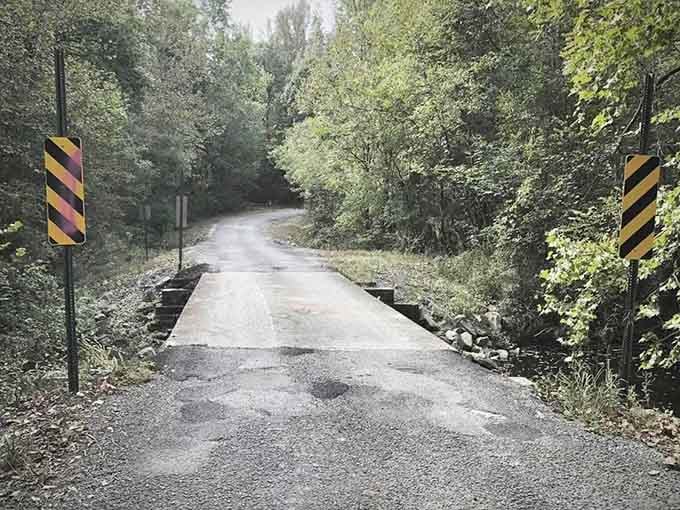 This weathered bridge beckons you forward into shadows that seem darker than they should be.