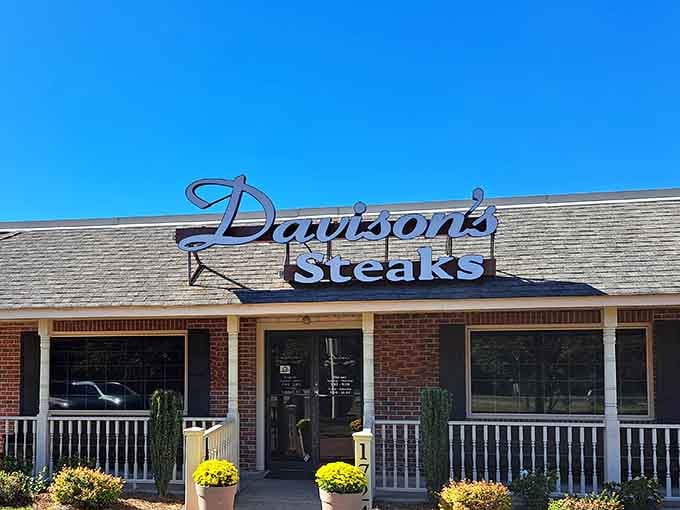 Those cheerful yellow mums flanking the entrance whisper "welcome home" while that elegant script sign practically sings about steaks.