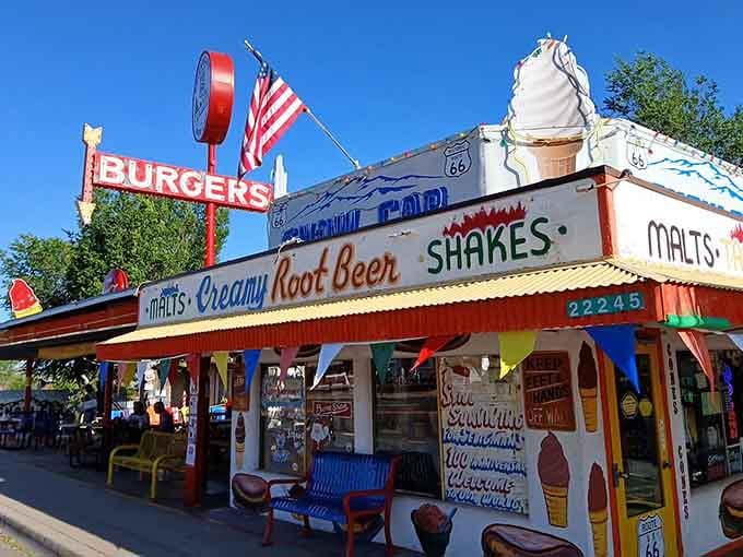 That giant swirled ice cream cone on the roof tells you everything about this playful roadside treasure.