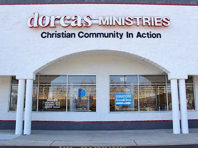 The welcoming arched entrance and clean white facade make this community gem feel like a neighborhood friend.