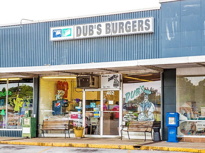 Behind that cheerful storefront with benches waiting outside, juicy burgers are being grilled to absolute perfection right now.