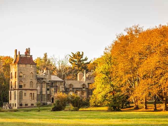 Fonthill Castle glows golden in autumn light, looking like something from a storybook that somehow landed in Pennsylvania.