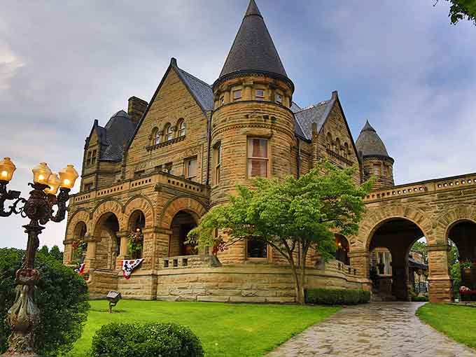 Golden stone and fairy-tale turrets make this mansion look like Rapunzel might lean out any window.