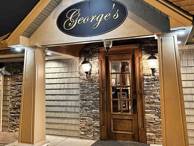 That elegant entrance with stacked stone and warm lighting says "special occasion" without being stuffy at all.