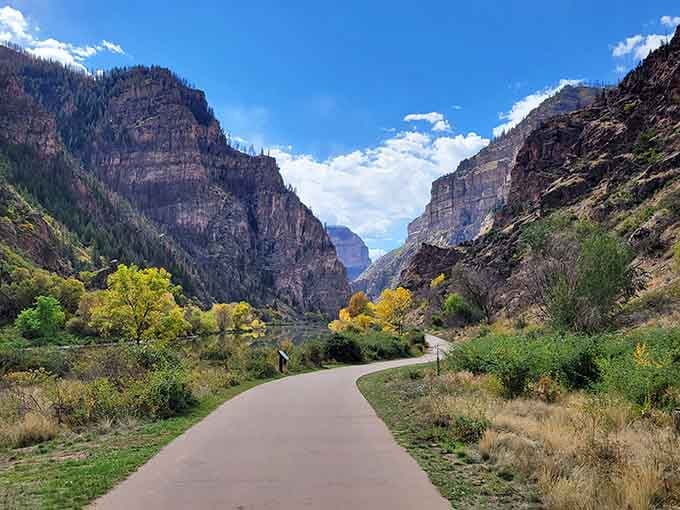 Canyon walls tower on both sides as the trail winds deeper into this stunning natural corridor.