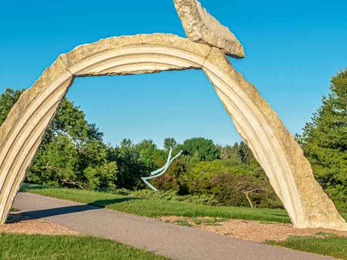This graceful arch frames the landscape like nature's own gateway to somewhere wonderfully unexpected.