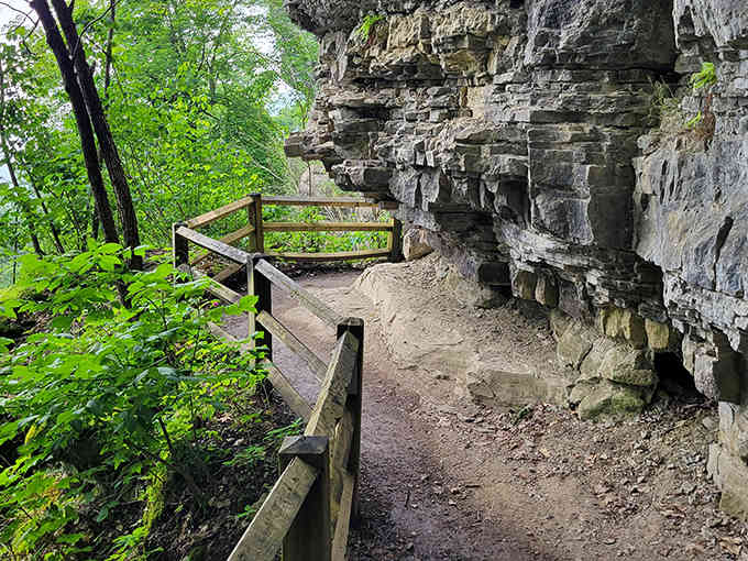 Walking under this massive rock overhang feels like exploring behind the scenes of the earth's greatest stage show.